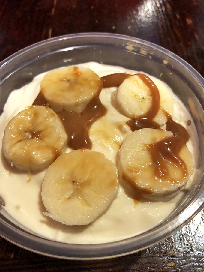 Banana pudding with caramel drizzle – the dessert equivalent of a warm hug from your favorite grandparent after you've already eaten too much.