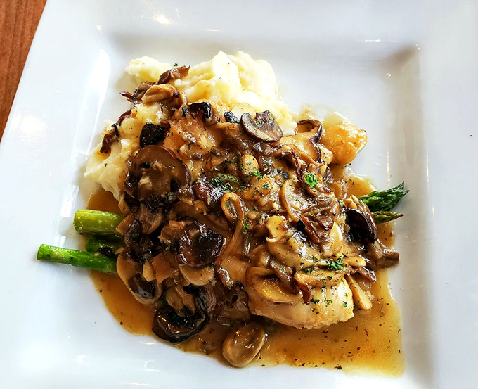 Chicken Marsala that whispers of Italy—tender breast bathed in mushroom-studded sauce that begs to be sopped up with every last bite of potato.