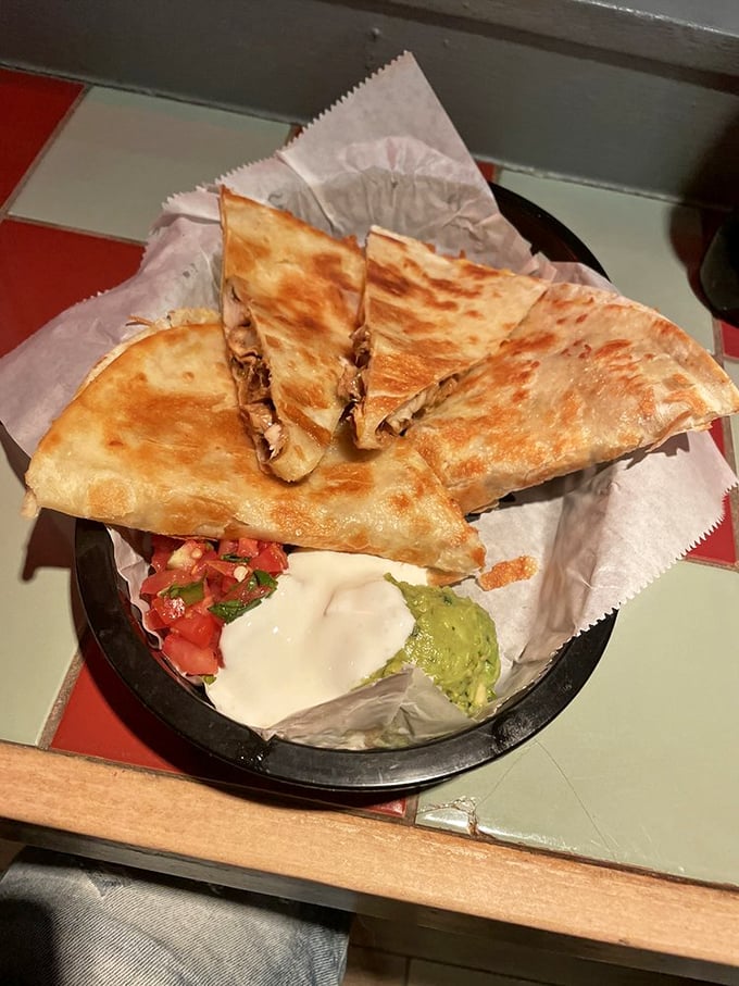 Quesadillas done right—crispy exterior, molten interior, with accompaniments that aren't afterthoughts but essential supporting characters.