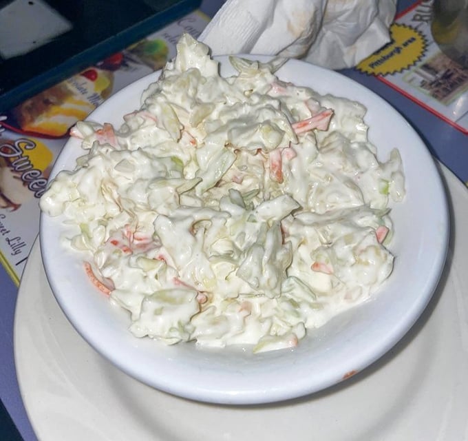 Even the coleslaw gets the royal treatment – creamy, crunchy, and the perfect cool counterpoint to the diner's heartier offerings.