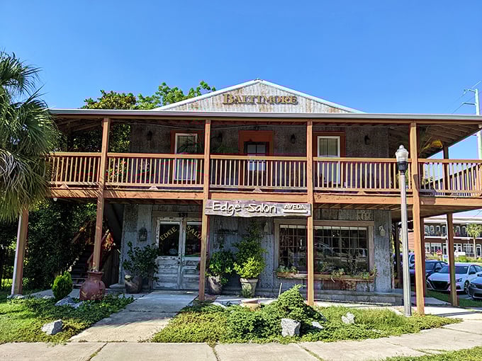 The weathered wood and welcoming porch of this historic building now housing Edge Salon tell stories of Apalachicola's resilience through changing times.