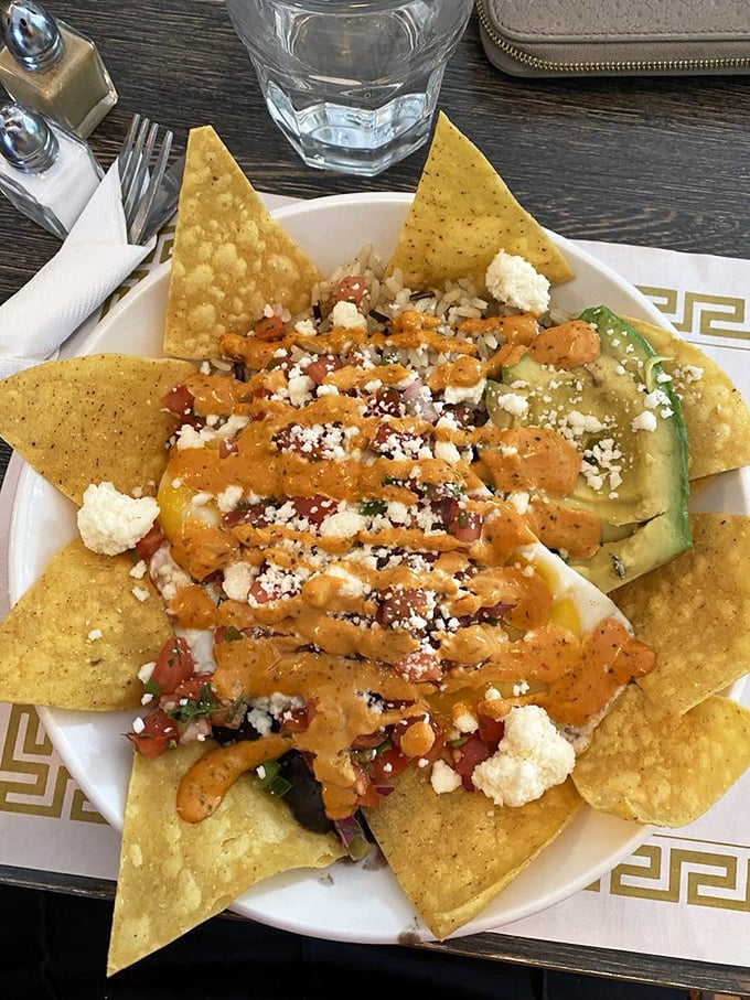 These nachos aren't just a meal—they're a fiesta on a plate, with each chip offering the perfect delivery system for multiple flavors.