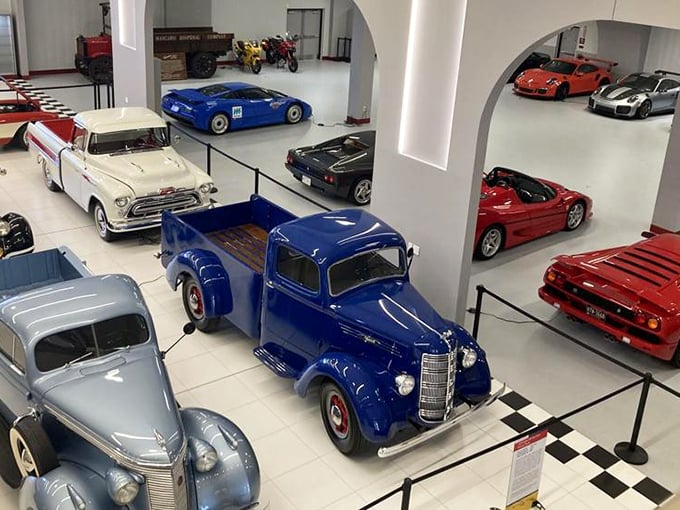 The museum's thoughtful layout creates automotive vignettes that span decades – from vintage American trucks to European exotics sharing the same pristine space.
