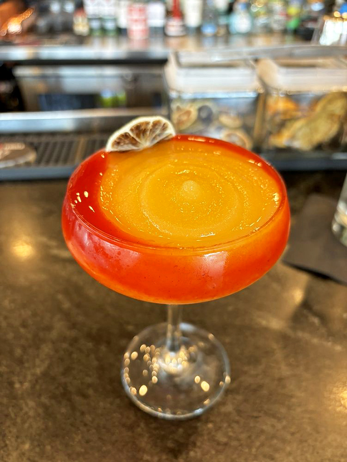 A mango margarita that glows with possibility. This sunset-in-a-glass doesn't just complement your tacos—it completes them.