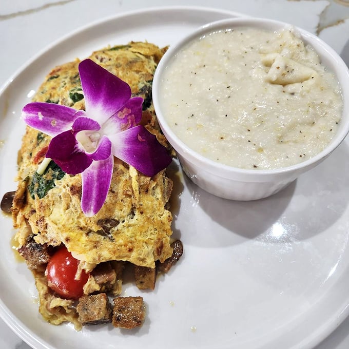This omelet, adorned with an orchid, is clearly showing off—and has every right to do so.