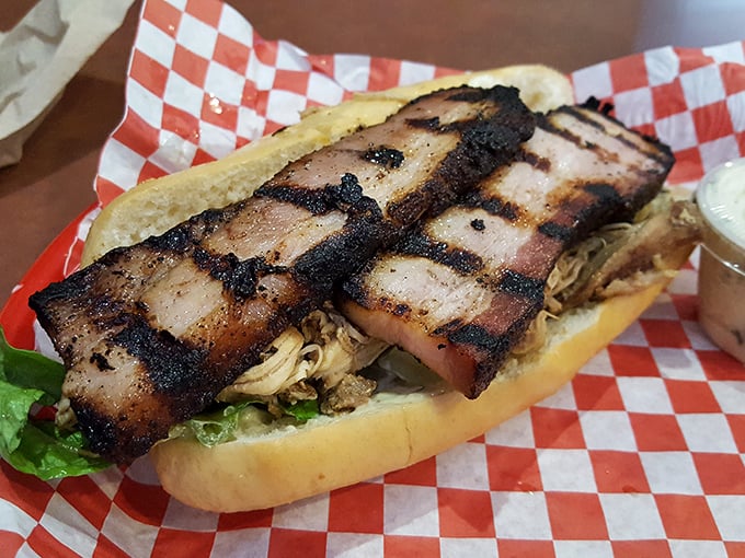 Sandwich architecture that would make Frank Lloyd Wright weep with joy. That bark-edged belly meat nestled in soft bread is pure poetry.