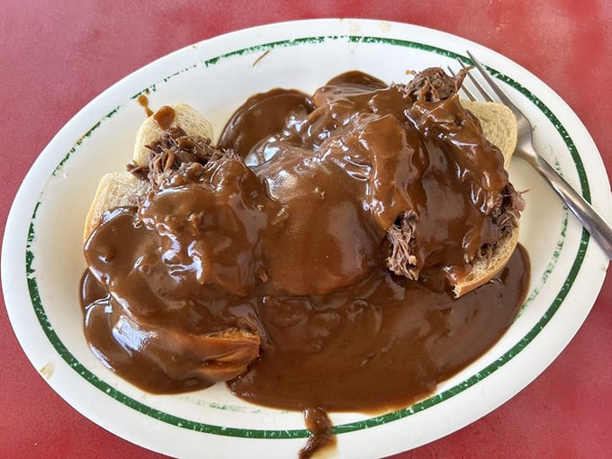 When gravy cascades over open-faced roast beef like this, you don't just eat lunch—you experience it. Fork and knife required, napkins essential.