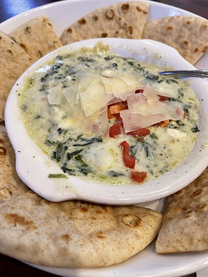 Spinach artichoke dip that achieves the perfect cheese pull—stretching just enough to make your tablemates jealous of your portion.