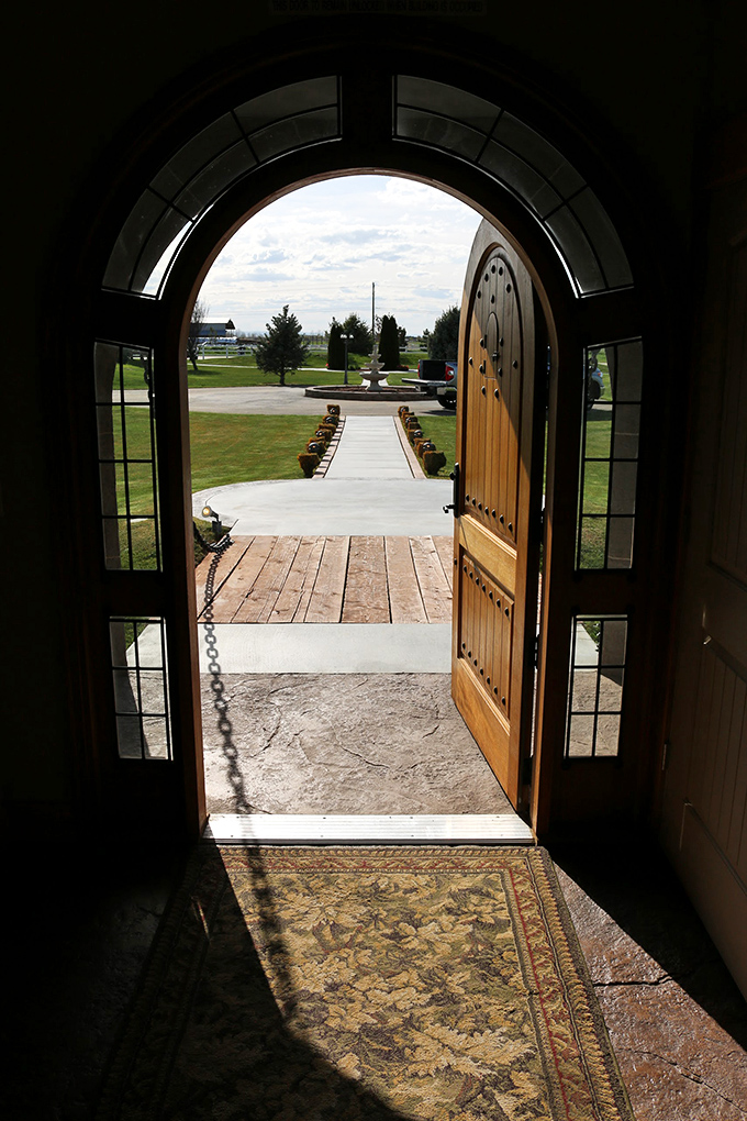Step through this arched doorway and leave the ordinary world behind—the heavy wooden door and iron hardware set the stage for the magic within.