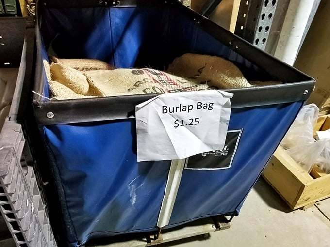 A bin of burlap bags priced at $1.25 each—crafters' gold in an unassuming blue container. Pinterest projects, meet your affordable supplier.
