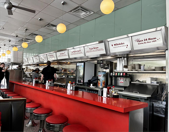 The counter—where solo diners become temporary members of the most comforting club in Atlanta, presided over by the coffee pot.