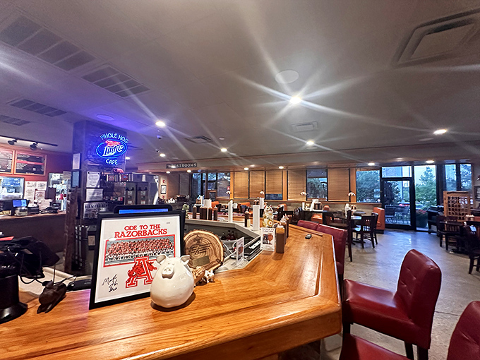 Razorback memorabilia and comfortable seating – where locals gather at the counter to debate important matters like sauce preference and smoke rings.