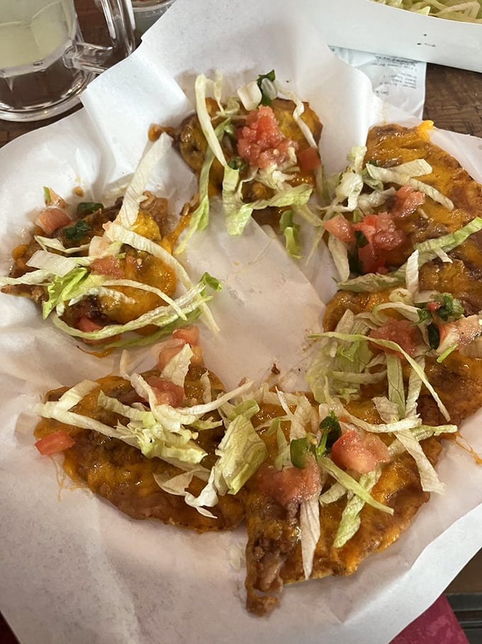 These aren't your average nachos—homemade chips, refried beans, and melted cheese create the perfect pre-burger appetizer.