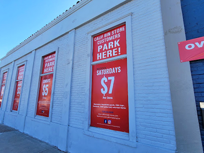 The exterior view showcasing the sliding price scale. These red window signs are basically real-life clickbait – and completely worth it.