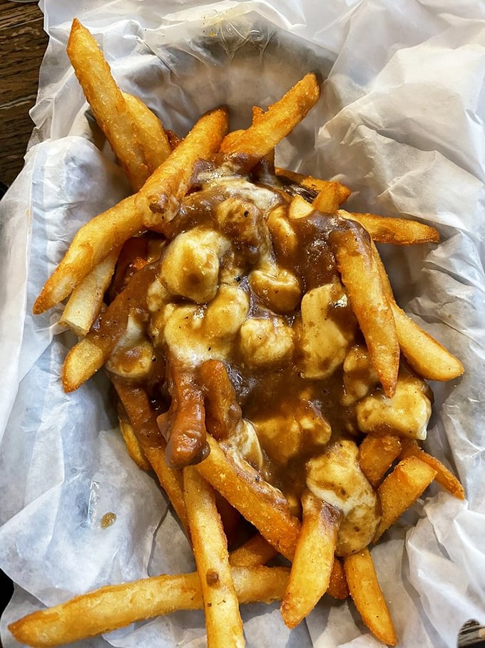 Poutine fries smothered in gravy and cheese curds—the Canadian classic gets a Midwest makeover that would make even the walking dead drool.