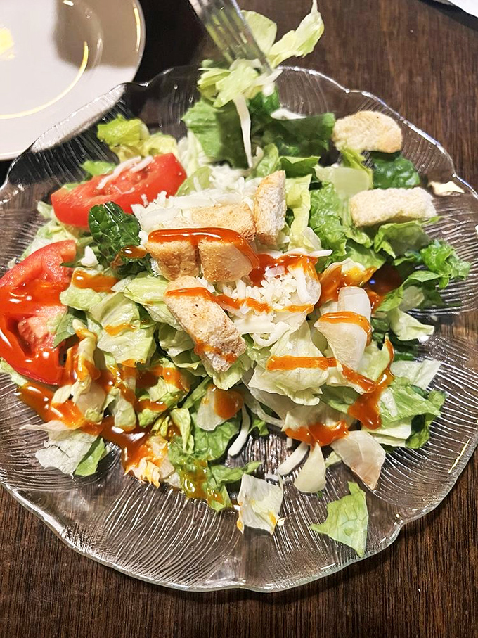 A salad that knows its role—fresh, crisp, and dressed just right. The opening act that somehow manages to steal a bit of the show.