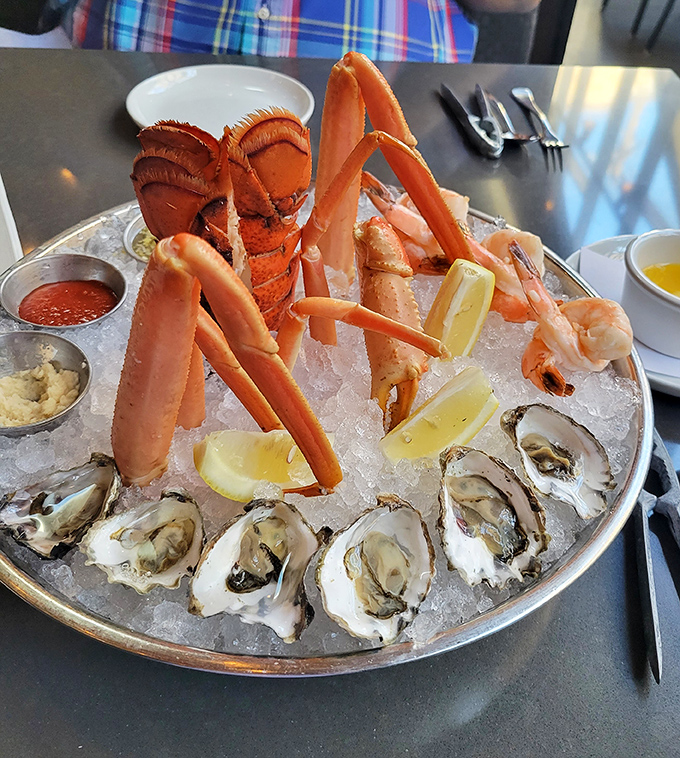 The seafood tower—where crab legs reach skyward like they're trying to return to the ocean. It's the aquatic equivalent of a Vegas showstopper.