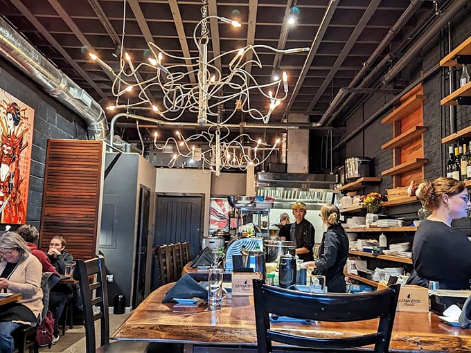 Modern industrial meets warm hospitality in the bar area. The perfect spot to contemplate how seafood this good ended up in Arkansas.