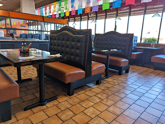 High-backed booths create little islands of privacy in a sea of festivity. These aren't just seats—they're front-row tickets to your own personal fiesta.