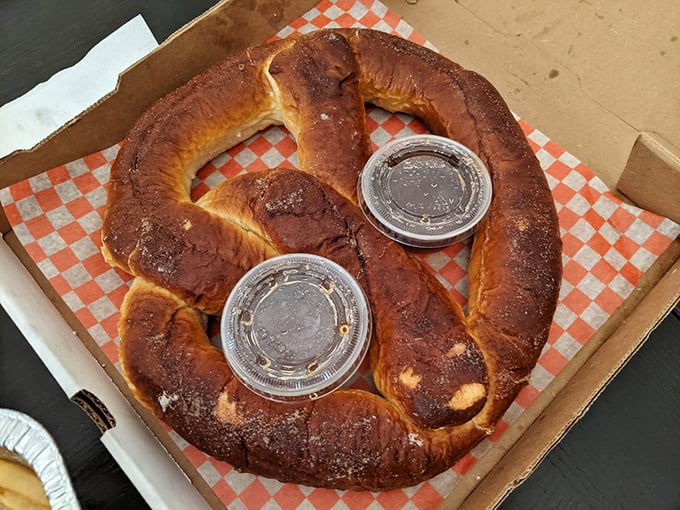 A pretzel so magnificent it deserves its own zip code. The dipping sauces are just supporting actors in this carb-loaded drama.