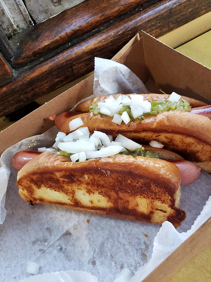 These grilled dogs nestled in toasted buns with the perfect ratio of relish, onions, and mustard are what summer dreams are made of.