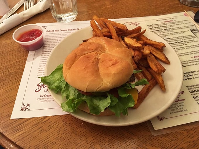 A burger that doesn't need Instagram filters to look good. Those fries aren't just side characters – they're co-stars in this lunch production.