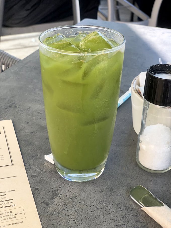 This vibrant green concoction isn't just a drink—it's liquid optimism promising wellness while you contemplate that side of bacon.