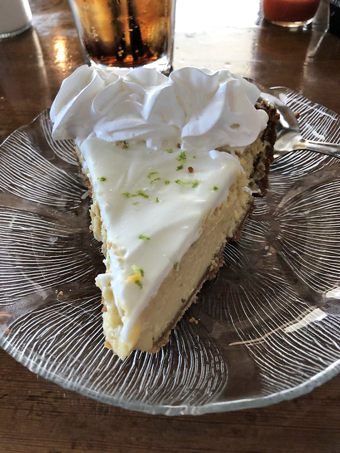Key lime pie so authentic it should come with its own passport—tart, sweet, and topped with enough whipped cream to make your cardiologist wince.