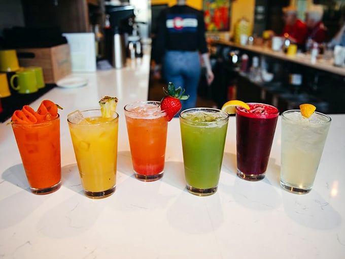 A rainbow of fresh juices lined up like edible artwork—proof that healthy choices can be just as Instagram-worthy as their indulgent counterparts.
