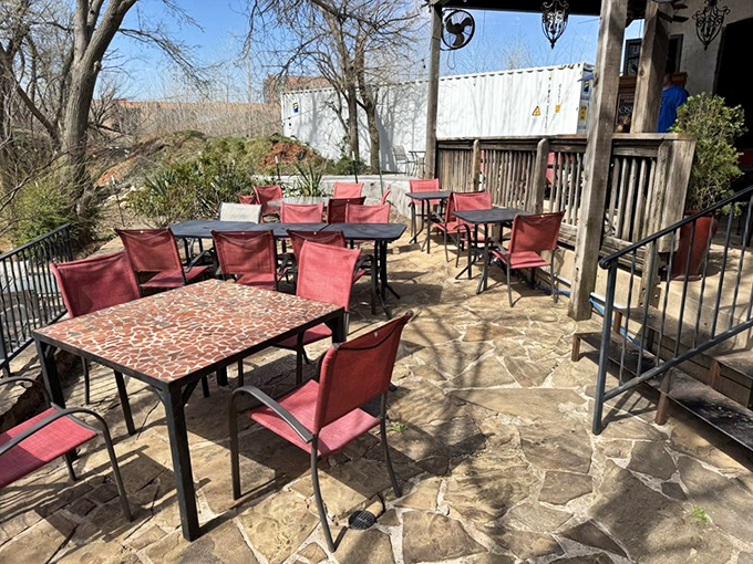 "Best Patio in Oklahoma" isn't just a slogan—it's where summer memories are made. Those red chairs have supported countless happy diners.