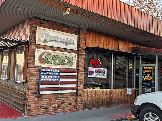 Beyond breakfast, Norma's exterior proudly announces its diverse menu offerings—from hamburgers to gyros—ensuring no appetite leaves unsatisfied.