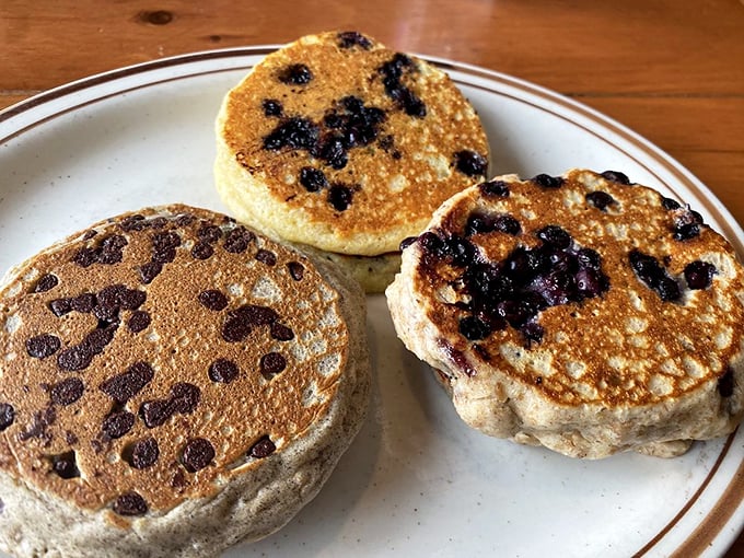 Blueberry pancakes that prove nature and griddles were meant to be friends. Each berry bursts with flavor like tiny flavor bombs in a fluffy battlefield.