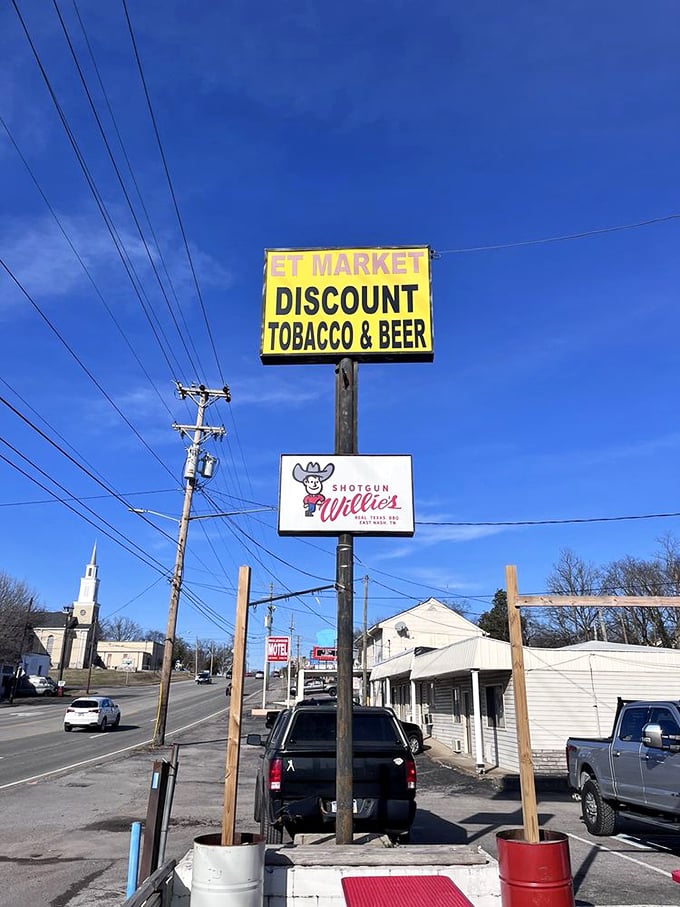 Even the roadside sign knows its role—guiding hungry travelers to barbecue salvation like a smoky North Star.