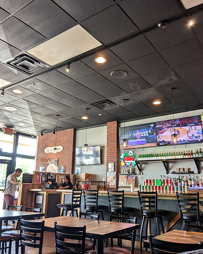 The bar area – because nothing complements crispy, spicy chicken like a cold beverage. Beer and fried chicken: proving that soulmates exist in food form.