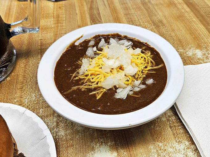 The chili arrives topped with a snowfall of onions and cheese—a hearty Missouri interpretation of comfort that warms you from the inside out.