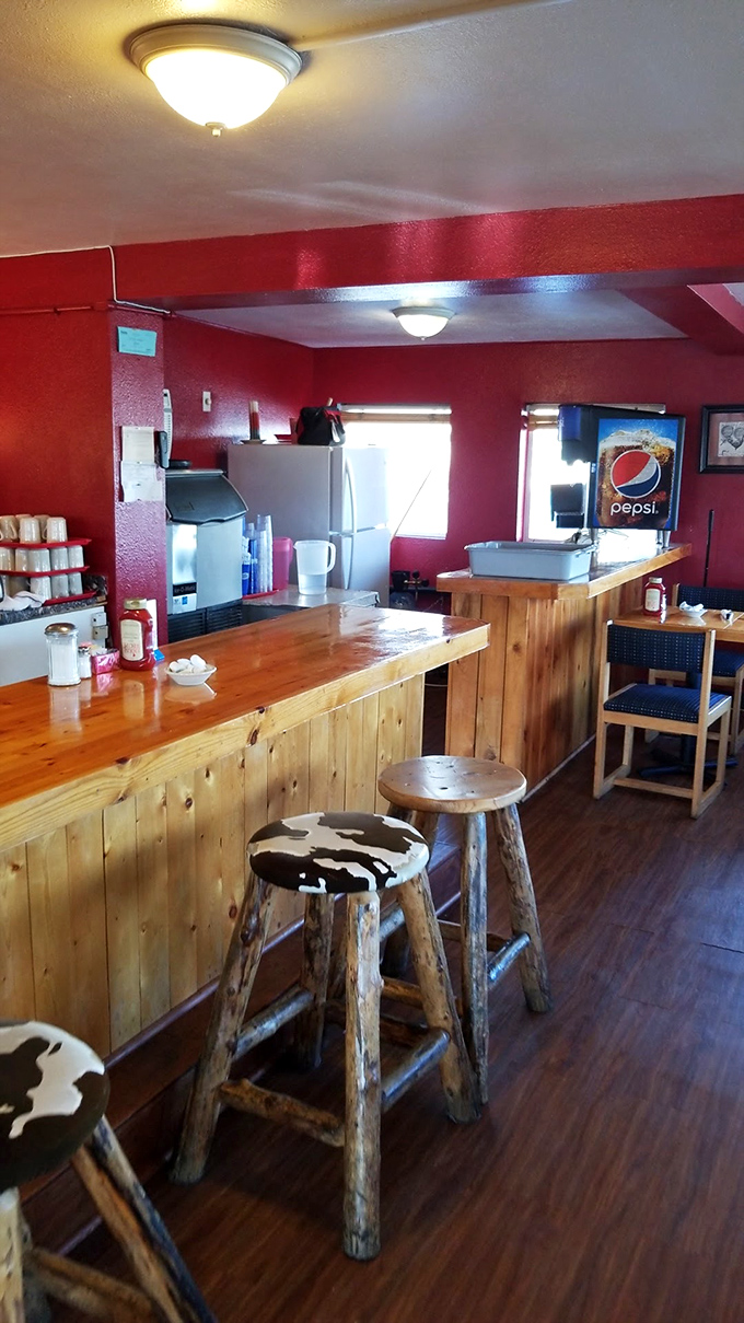Counter seating with rustic stools that tell you this place values substance over style. Where coffee refills and local gossip flow with equal generosity.