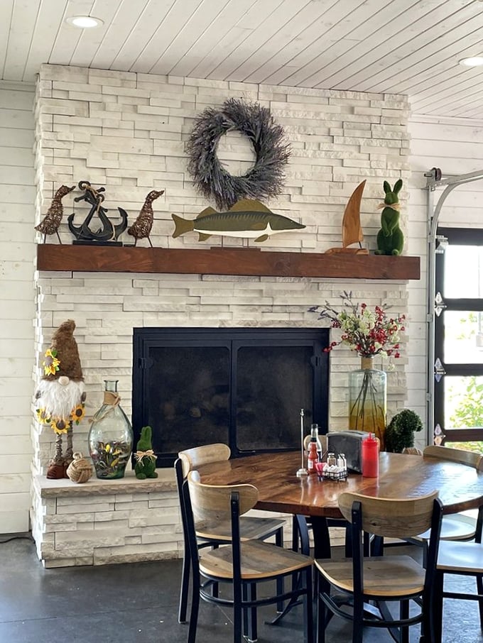 A cozy fireplace corner that makes winter seafood cravings even more satisfying. Nautical decor and warm flames—the perfect backdrop for comfort food.