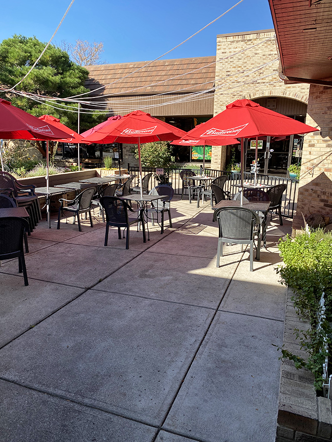 The outdoor patio where summer evenings stretch into the perfect blend of Colorado weather and Italian hospitality—complete with umbrella shade for those serious about their al fresco dining.