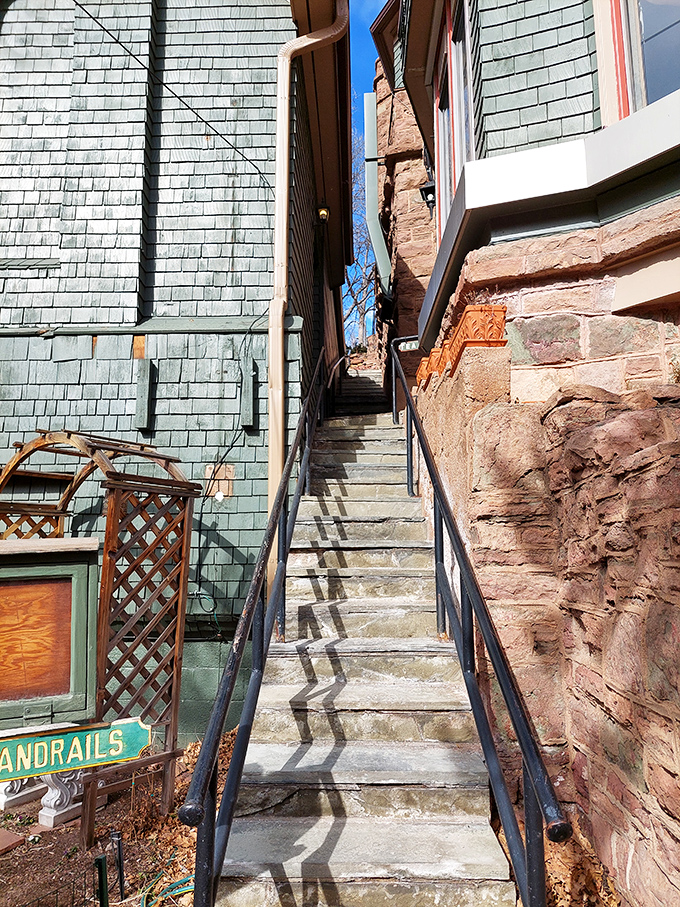 These narrow stone steps, wedged between mismatched architectural styles, perfectly capture the castle's charming architectural identity crisis.