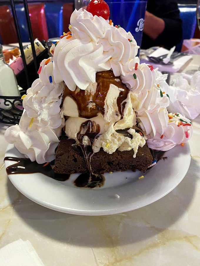 The dessert that thinks it's a skyscraper—a towering monument to sweetness that makes nearby cheesecakes feel like they need to step up their game.
