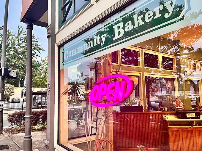 Community Bakery's storefront welcomes you with a cheerful "OPEN" sign – the universal symbol for "donuts are happening here!"