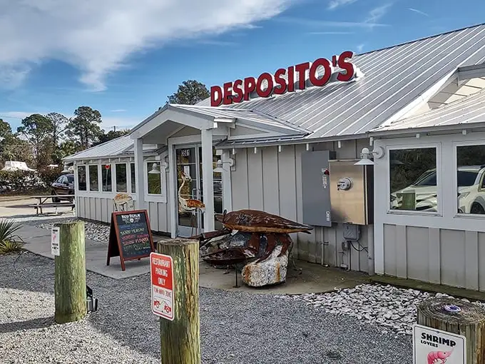 The pristine white building with that metal roof isn't trying to impress you—until the seafood arrives and does all the talking.