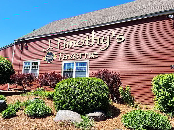 J. Timothy's Taverne's rustic red exterior promises comfort food magic within – like finding a delicious secret in plain sight.