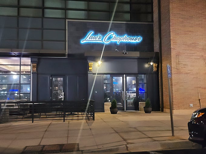Law's Chophouse (exterior night): "That blue neon glow isn't just a sign—it's a beacon calling all steak lovers home to paradise."