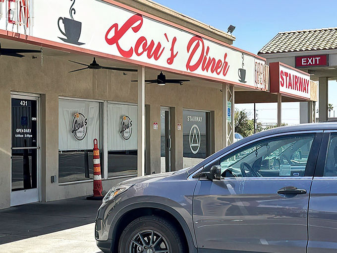 Lou's Diner's iconic red sign promises comfort food that'll make you forget your diet faster than you can say "extra bacon."