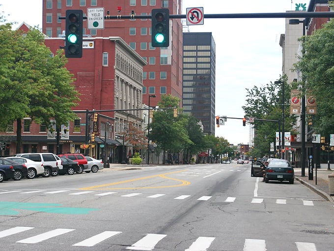 Downtown Manchester's historic charm shines through its brick buildings and wide streets. A perfect blend of urban convenience and New England character.