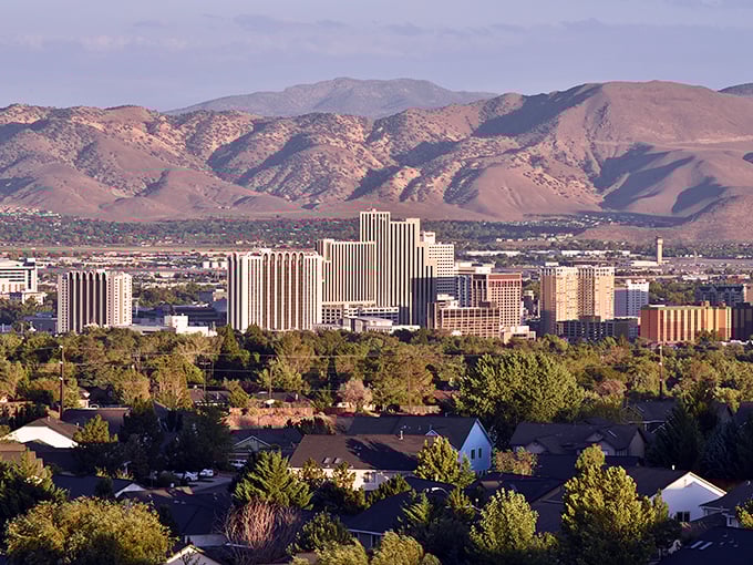 Reno's skyline nestled against the Sierra Nevada mountains – where affordable living meets breathtaking natural beauty.