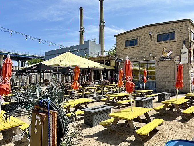 Yellow picnic tables at Twisted Fisherman create a beachy oasis in urban Milwaukee. Sunshine, cold beer, and fresh seafood—what more could you want?
