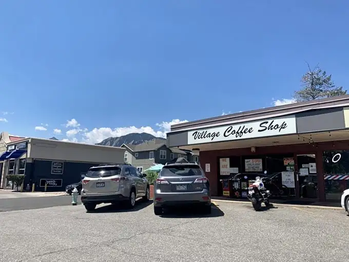 The Village Coffee Shop's unassuming exterior hides Boulder's breakfast paradise – where pancakes are the size of frisbees and coffee flows like mountain streams.