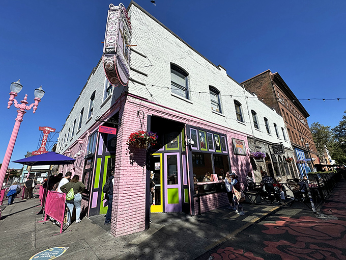 The iconic red exterior of Voodoo Doughnut, where sugar-fueled dreams come true and lines form at all hours.
